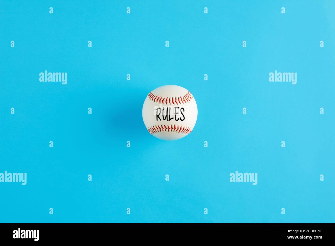 Baseball ball on blue background with the word rules. Baseball rules ...