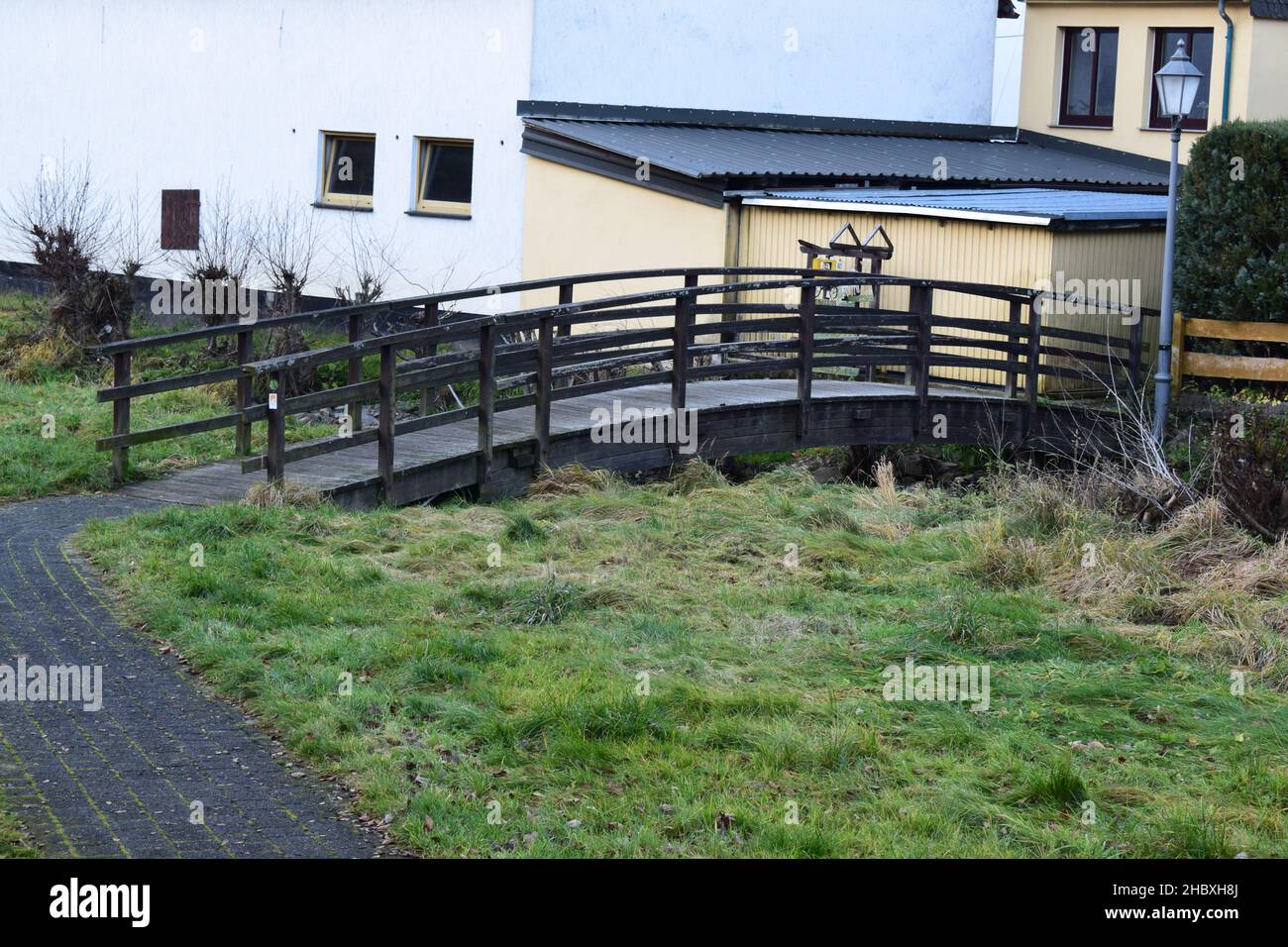 wooden bridge across a tiny river Stock Photo - Alamy