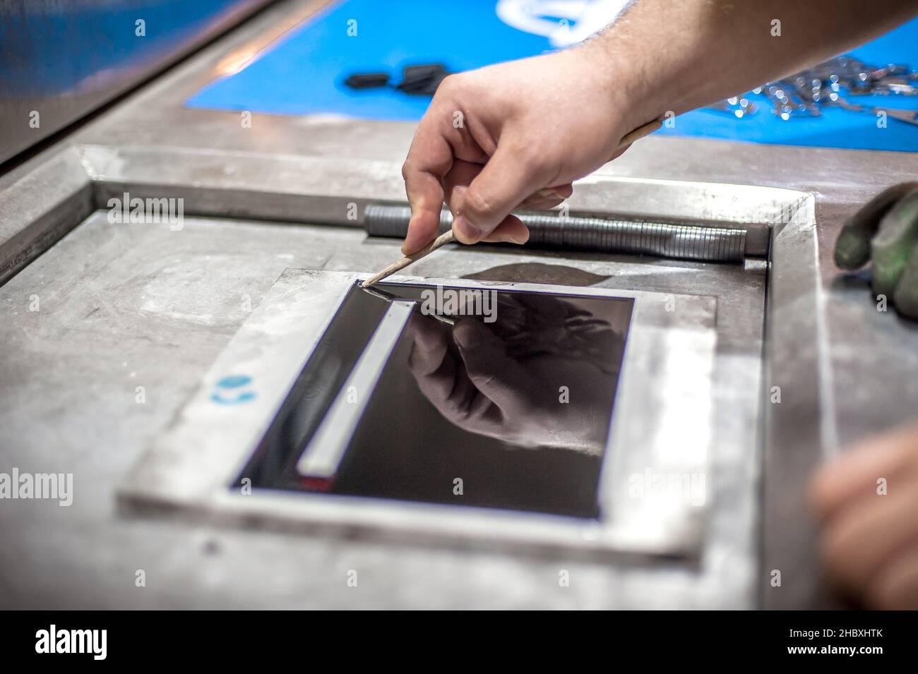 Professional worker technician work with soft PVC liquid rubber in mold ...