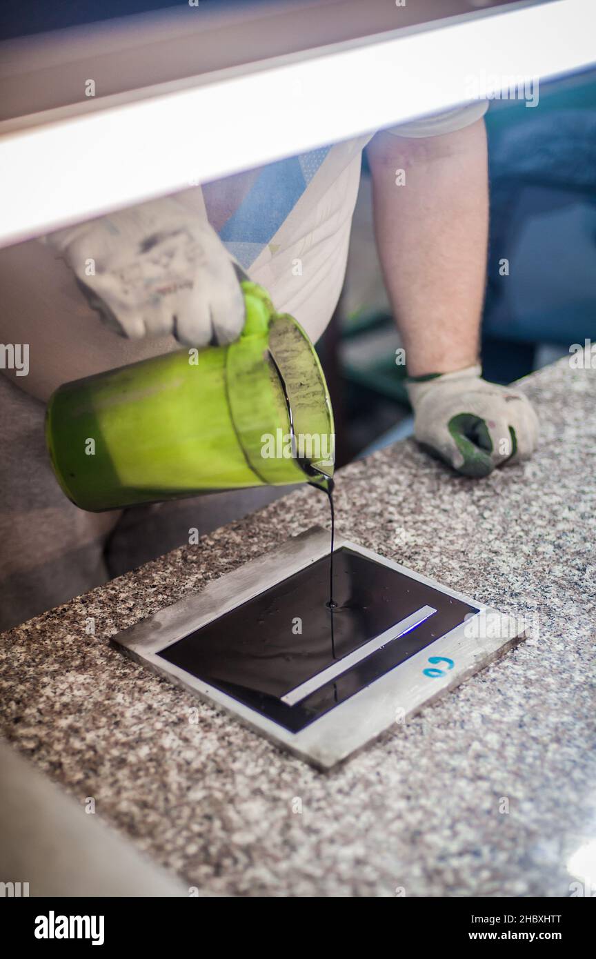 Professional worker technician work with soft PVC liquid rubber in mold ...