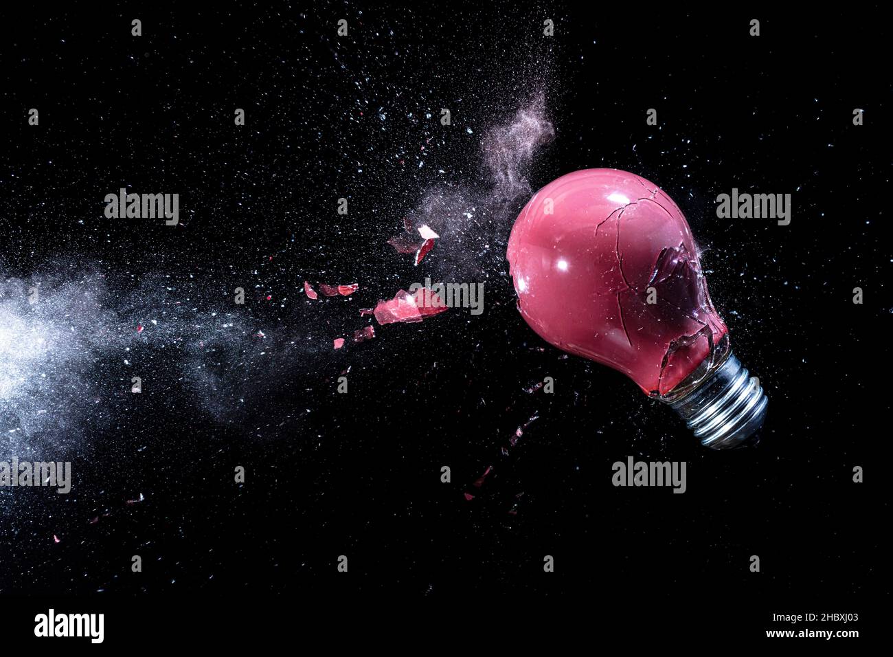 explosion of a red light bulb on black. high speed photography Stock ...