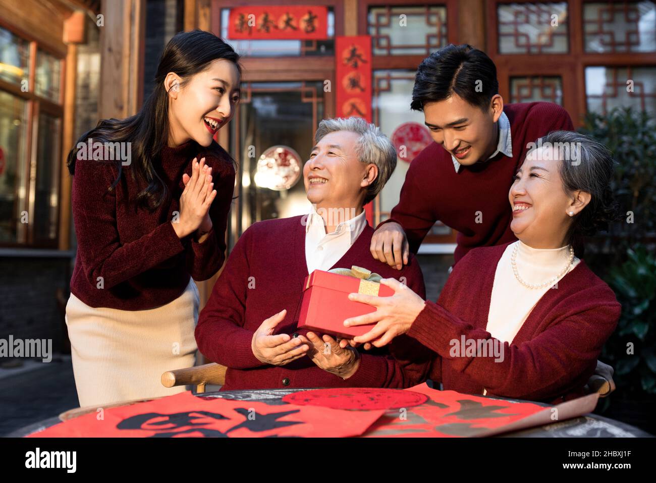 Children giving their parents New Year gifts Stock Photo - Alamy