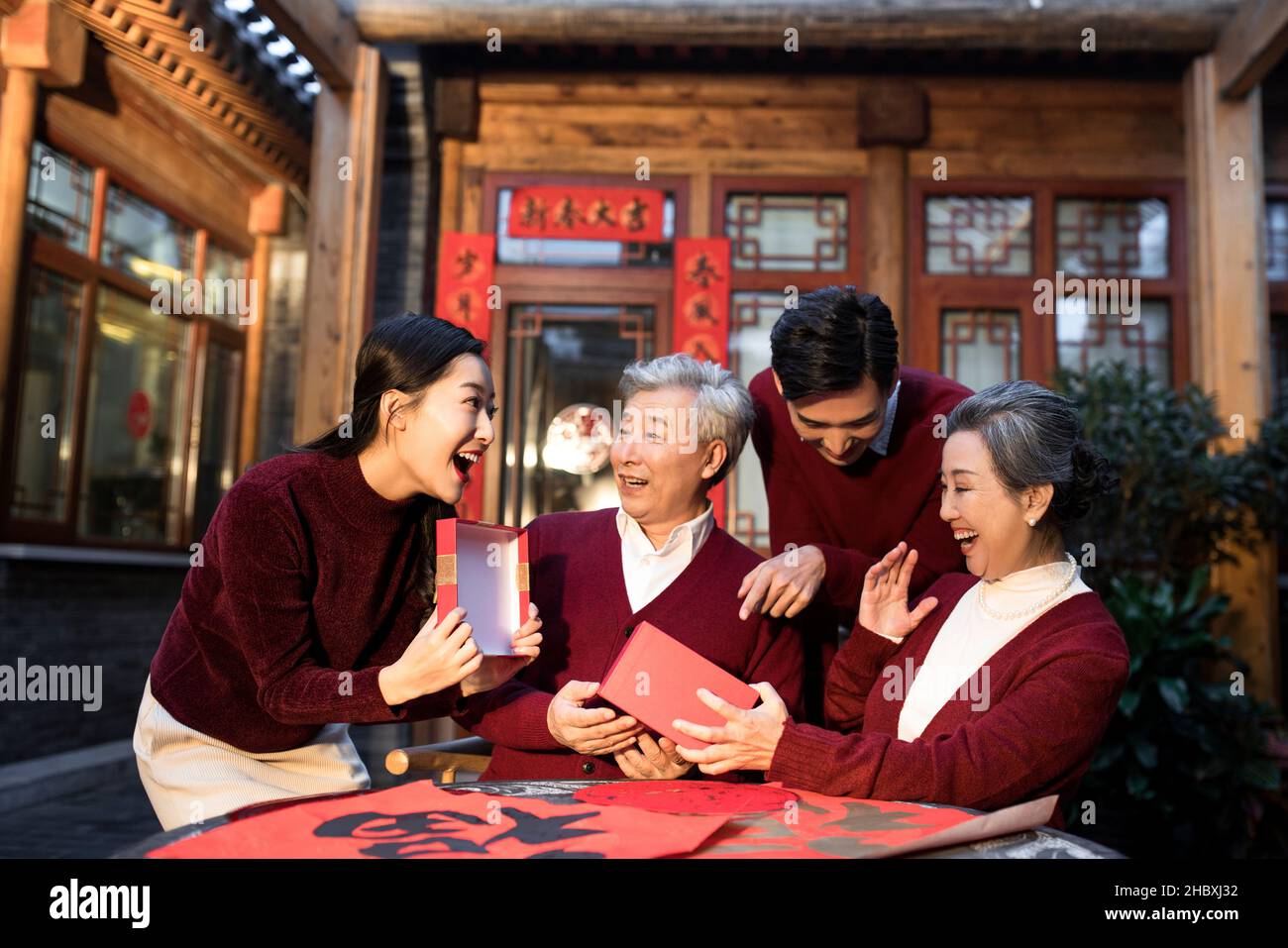 Children giving their parents New Year gifts Stock Photo - Alamy