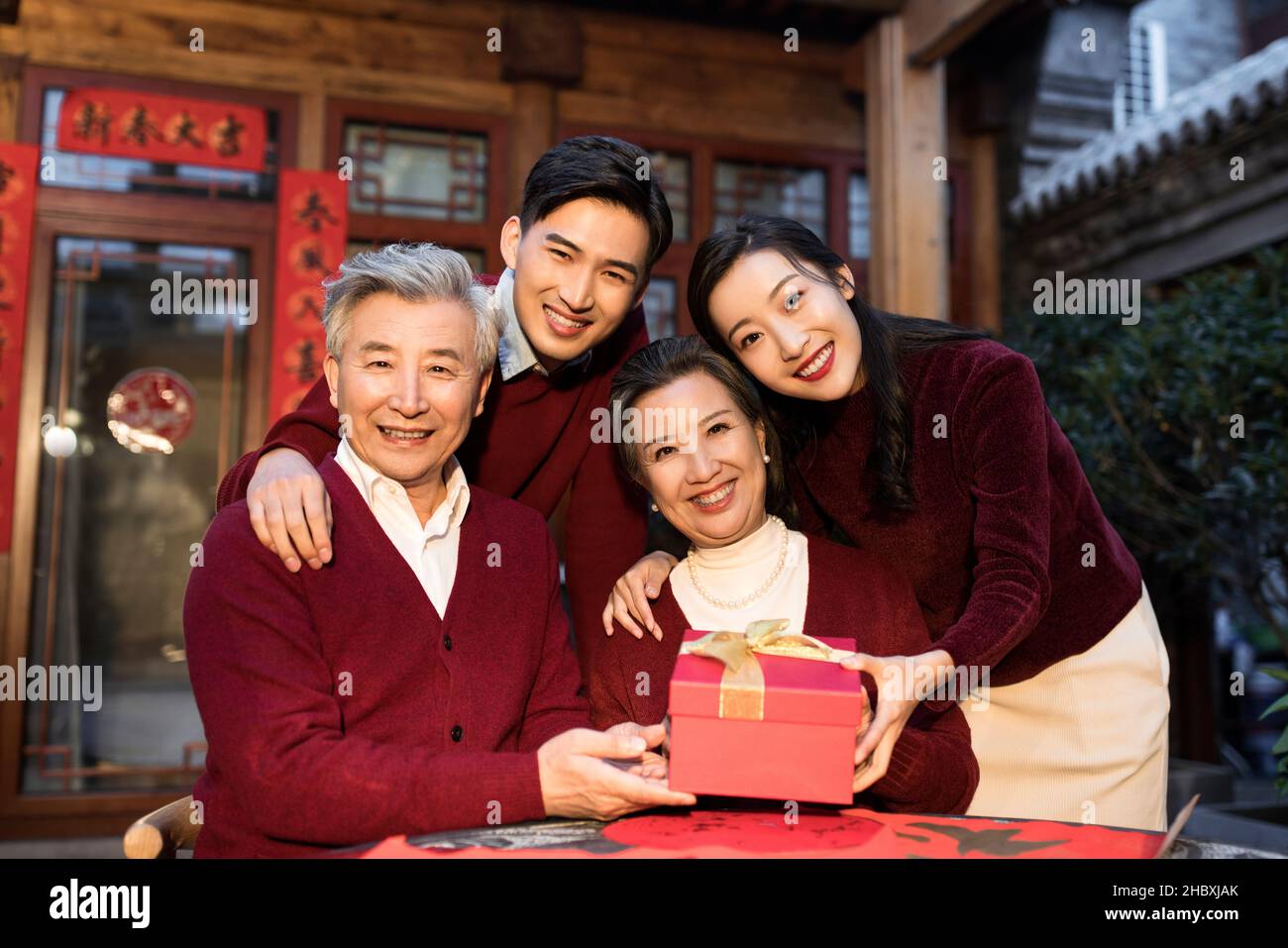 Children giving their parents New Year gifts Stock Photo - Alamy