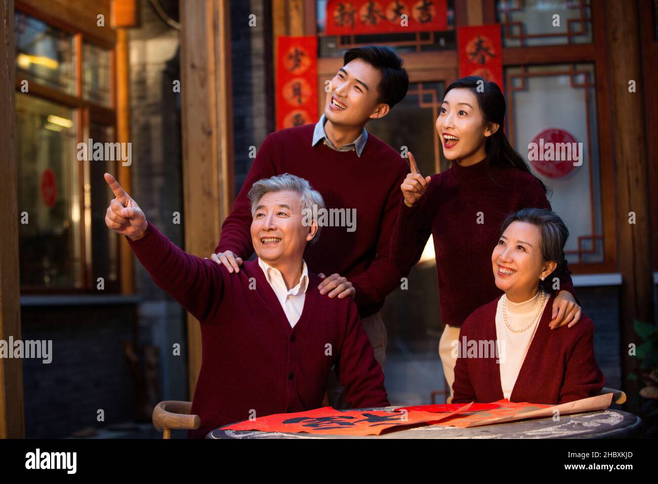 Family celebrating the New Year and looking into the distance Stock ...