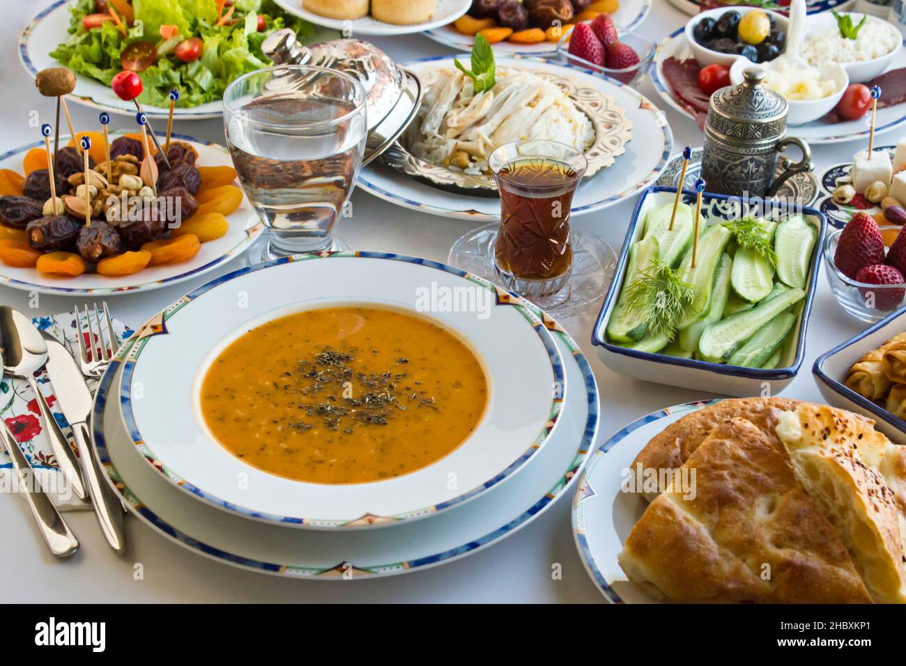 Ramadan,iftar dinner table with soup,chicken,rice,salad,dry and fresh ...