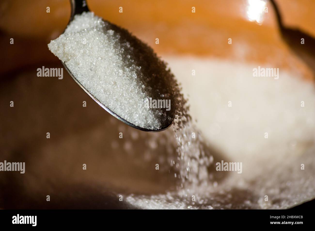 A teaspoon of sugar, granulated sugar sprinkles over the edge Stock ...