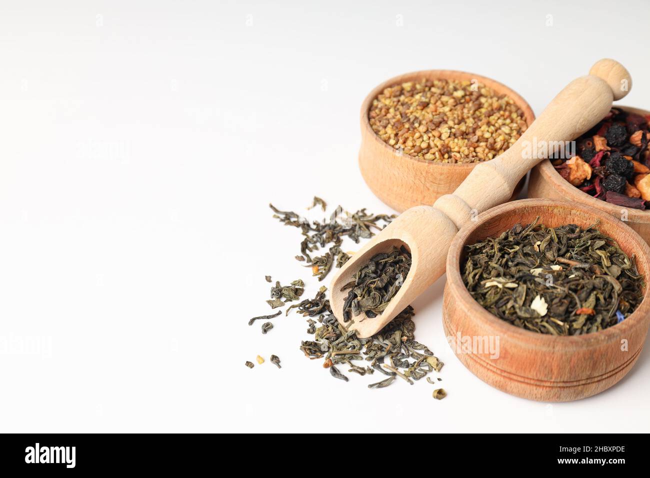 Concept of cooking tea with different types of tea on white background ...