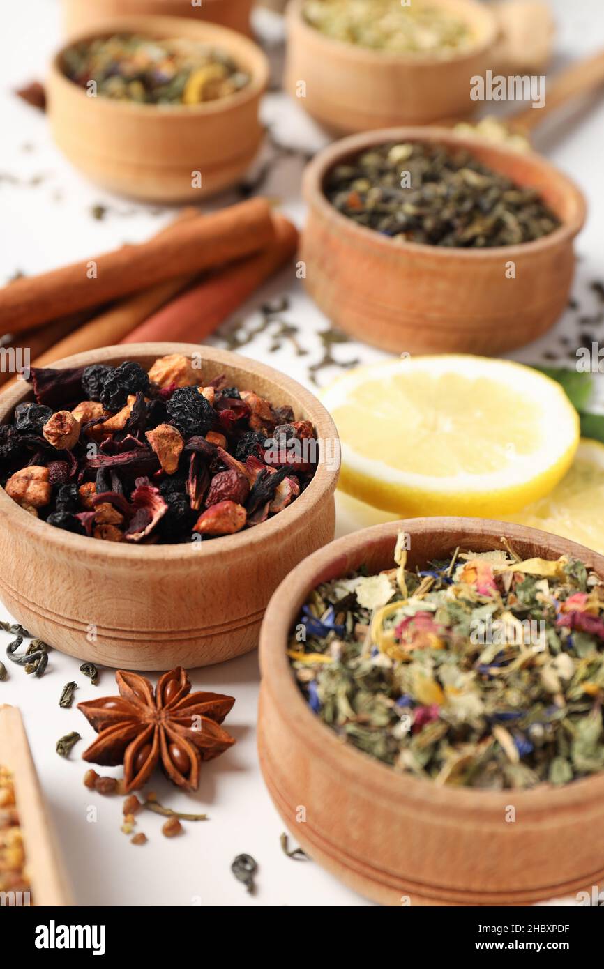 Concept of cooking tea with different types of tea on white background ...