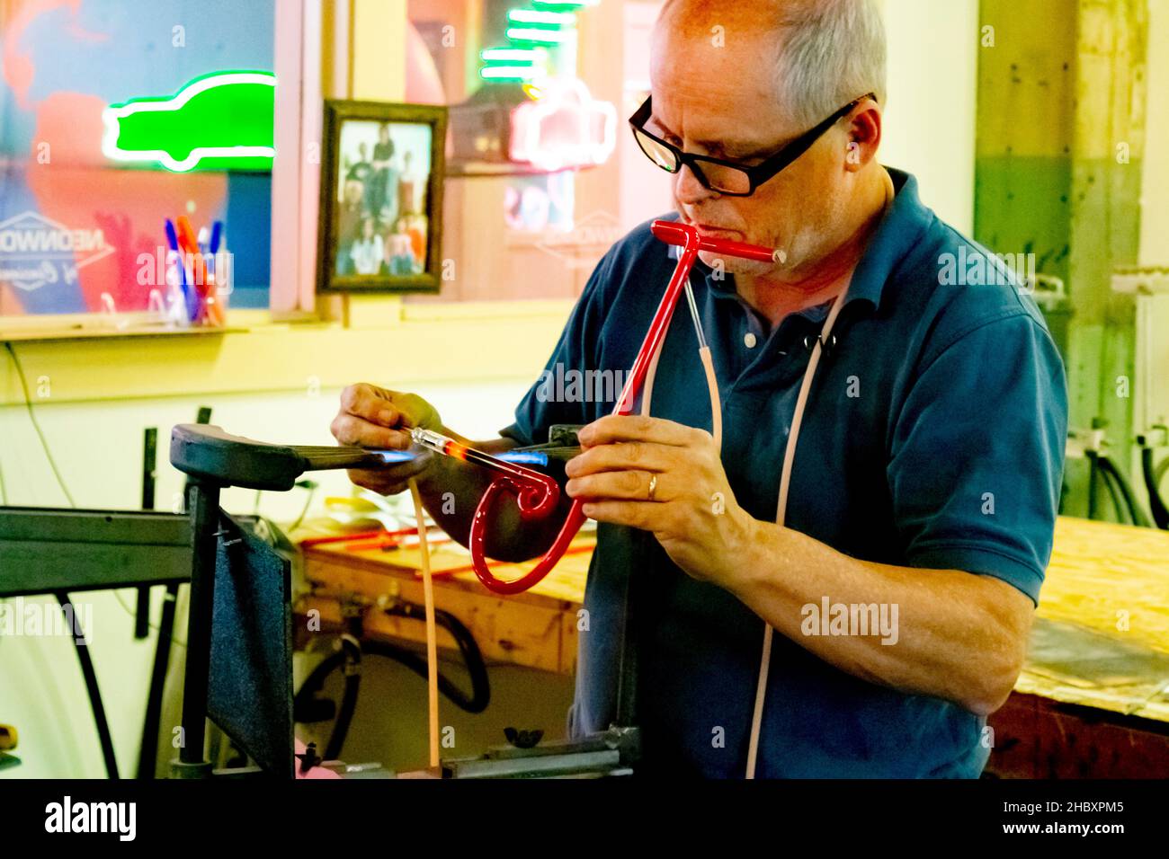 craftsman making neon signs from glass tubes Stock Photo - Alamy