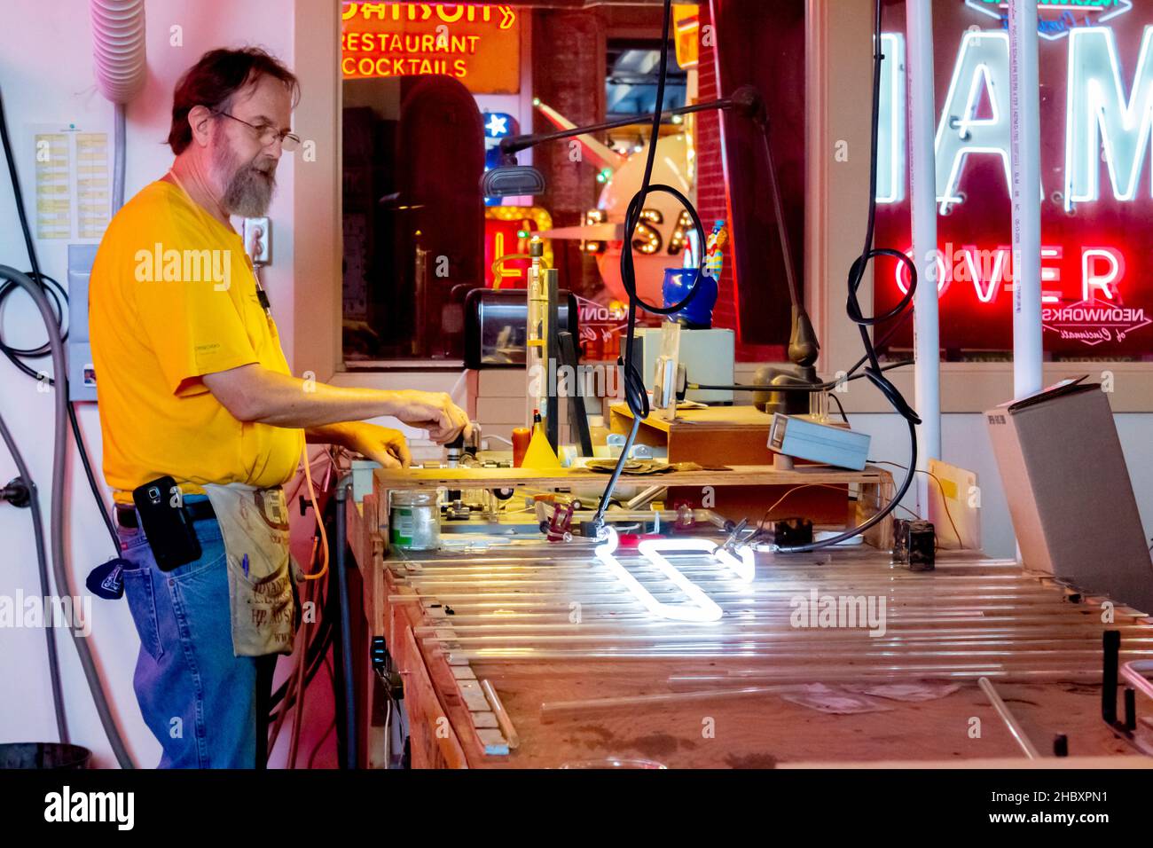 craftsman making neon signs from glass tubes Stock Photo - Alamy