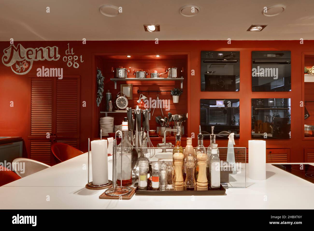 Italian themed kitchen with island covered in condiments and seasonings ...