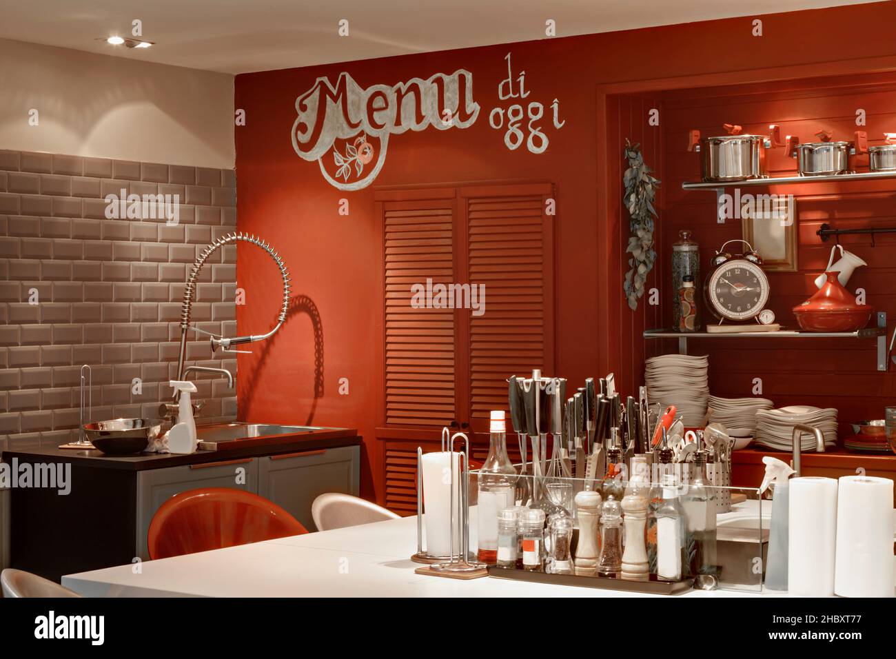Italian themed kitchen with island covered in condiments and seasonings ...