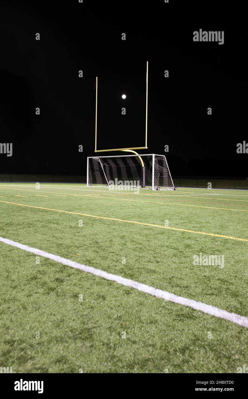 A white ball between the posts on a sports field, scoring Stock Photo ...