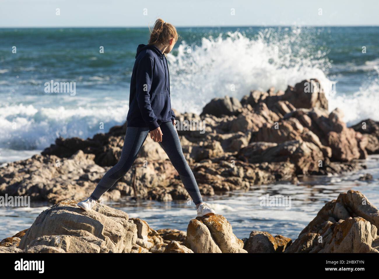 Rocks and surf girl hi-res stock photography and images - Alamy