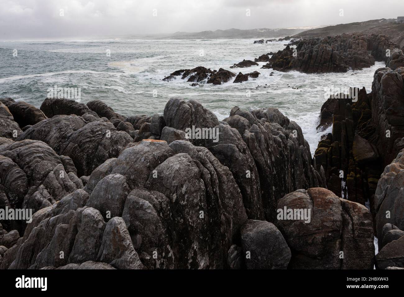 Jagged rocks and the rocky coastline of the Atlantic at De Kelders ...