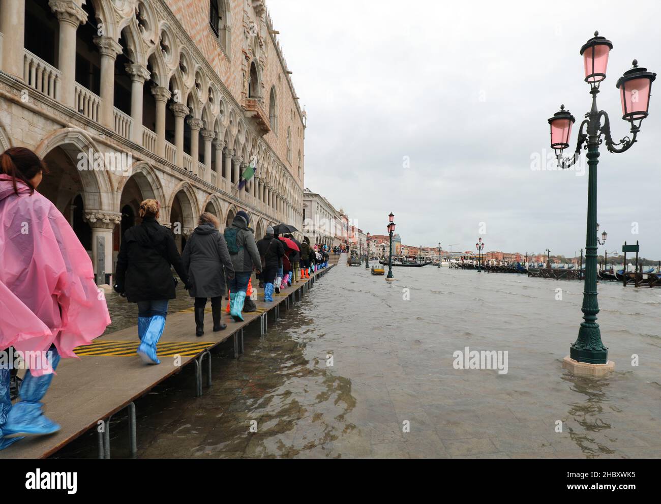 People on the Pedestrian walkways in front of the Ducal Palace during ...