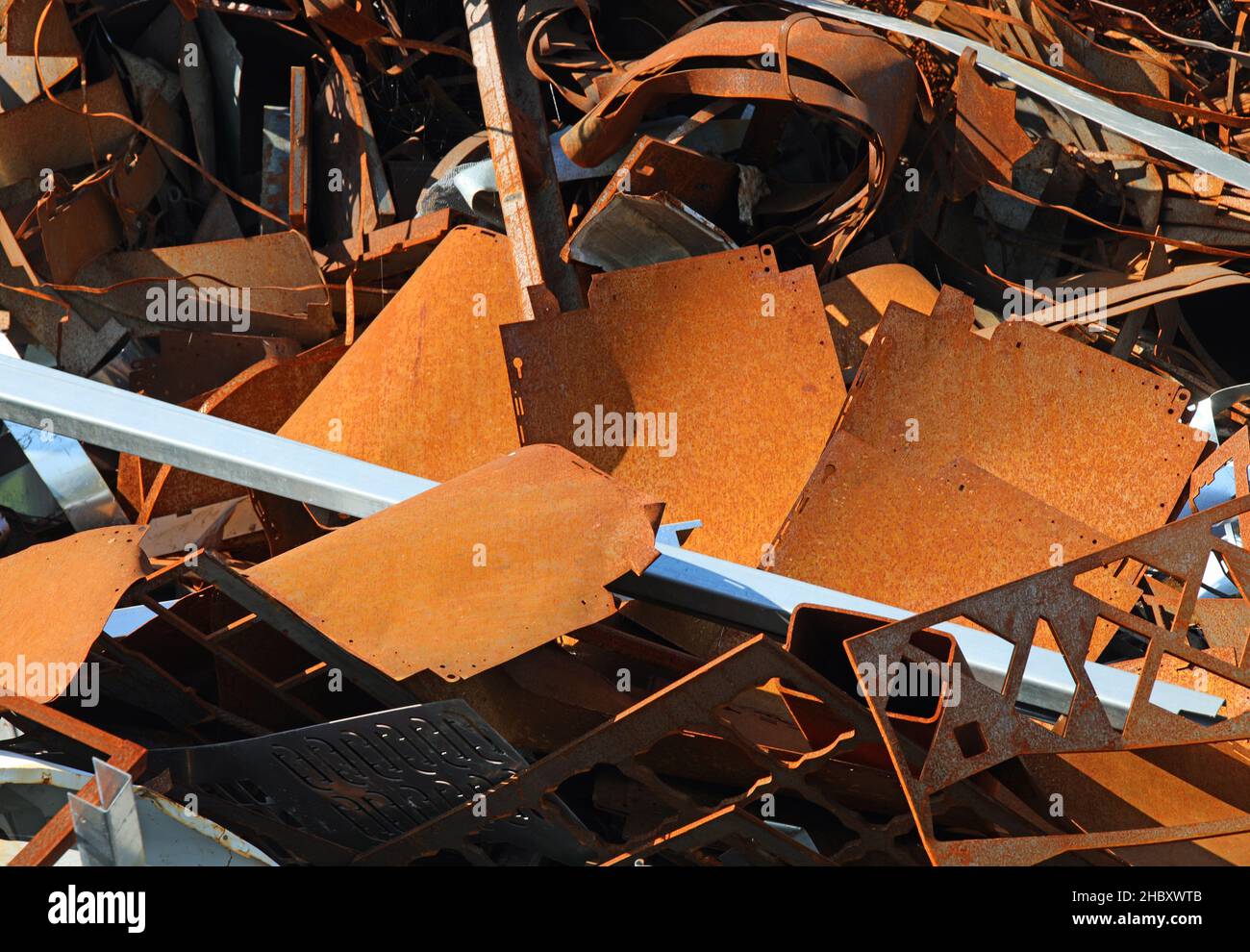 rusted ferrous scrap from a landfill for the recycling of used material ...