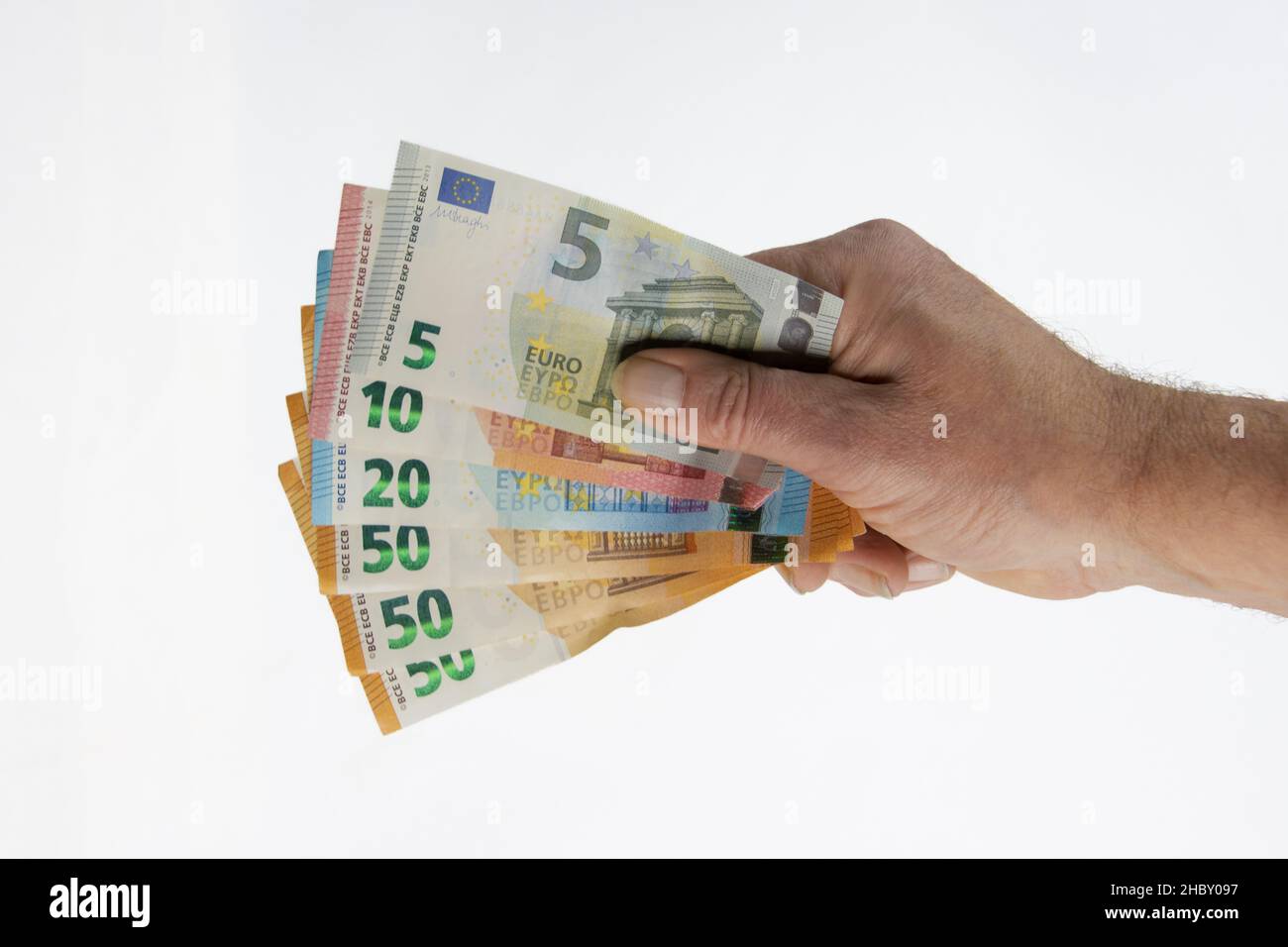 Hand holding euro banknotes isolated on white background Stock Photo ...