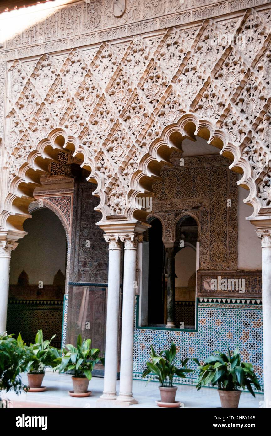 Multifoil arches and Moorish arabesque at the Royal Alcázar of Seville ...