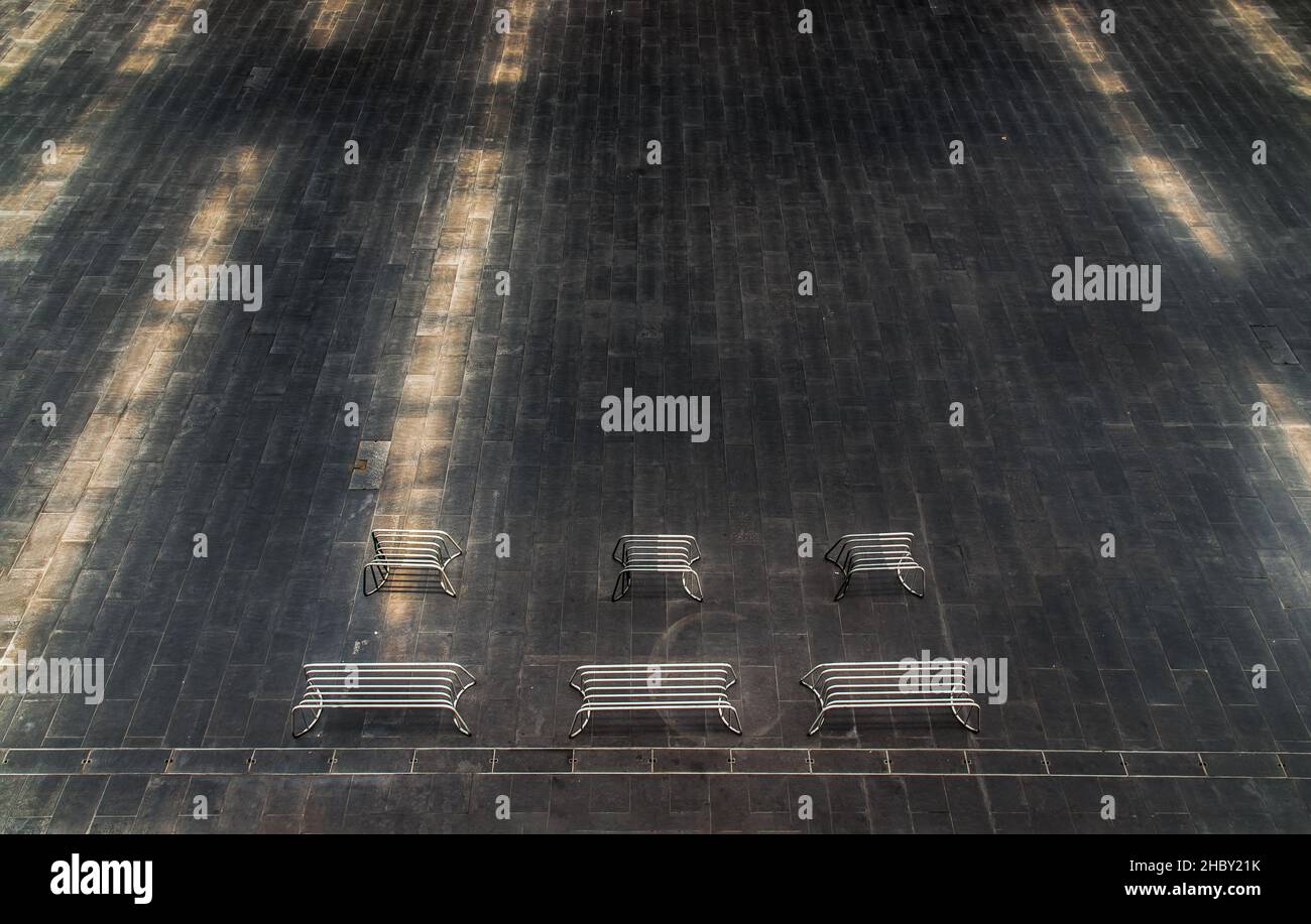 Perspective outdoor white metal benchs in open empty space area of the ...