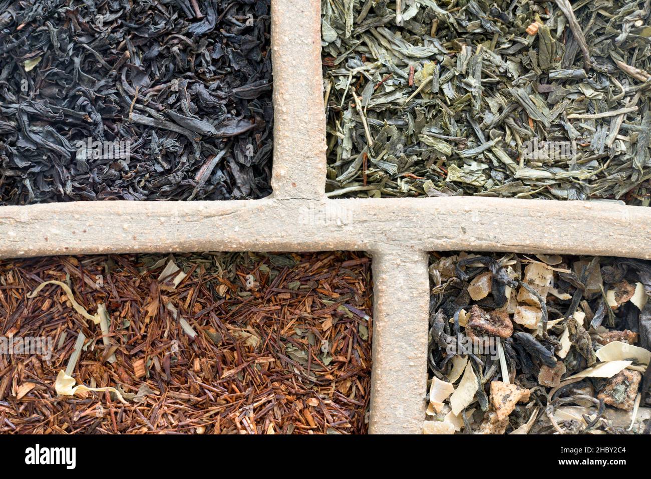4 types of tea, portioned. Black, green, red rooibos and white. macro ...