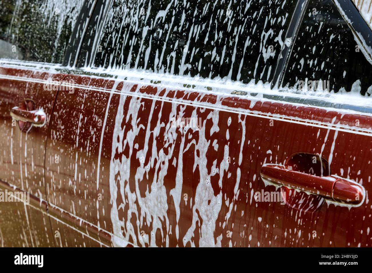 Cleaning the car with a pressure washer at jet wash Stock Photo - Alamy