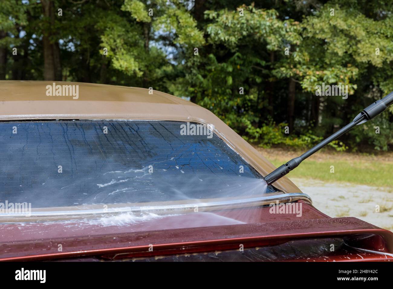 Cleaning the car with a pressure washer at jet wash Stock Photo - Alamy