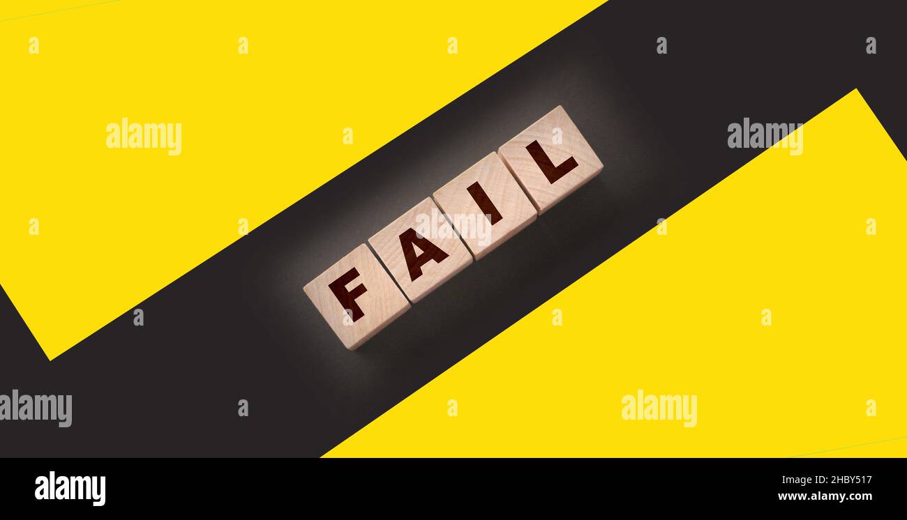 FAIL Word text Written In Wooden Cube blocks on black background ...