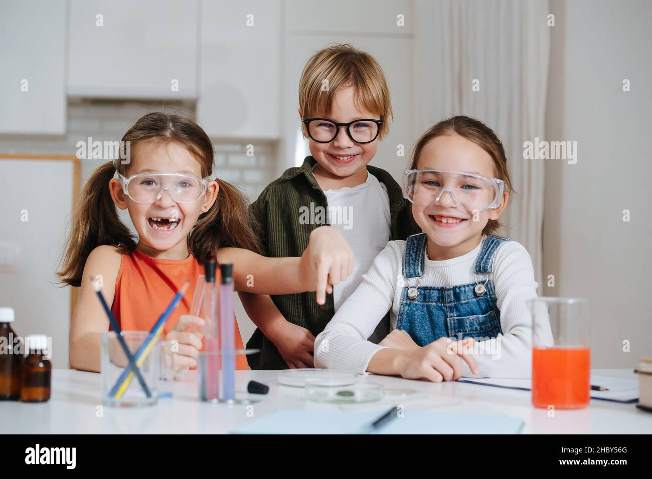Social little kids doing home science project, sharing their fun ...