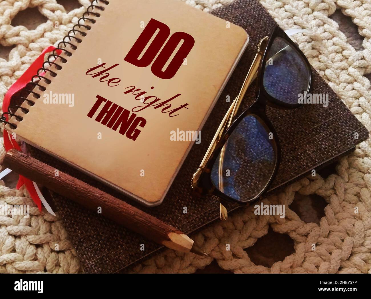 Text Do The Right Things words on the cover of notebook , eyeglasses ...