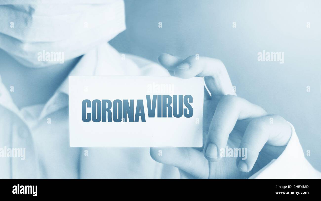 Medical Staff Holding Card With Coronavirus written on it. CoVid-19 ...