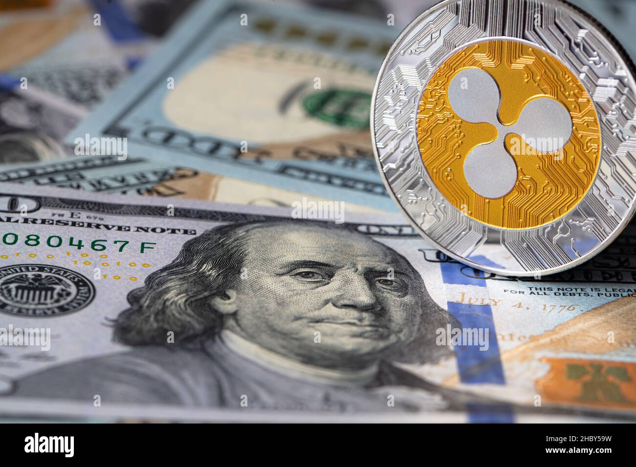 Ripple coin, XRP token, cryptocurrency on US 100 dollar background for ...