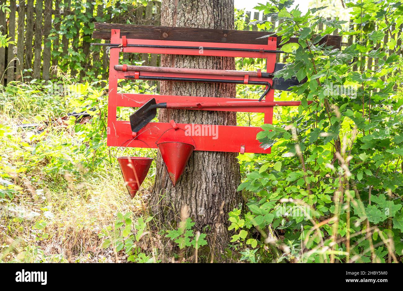 Firefighter shield with fire extinguishing tools in Russian village ...