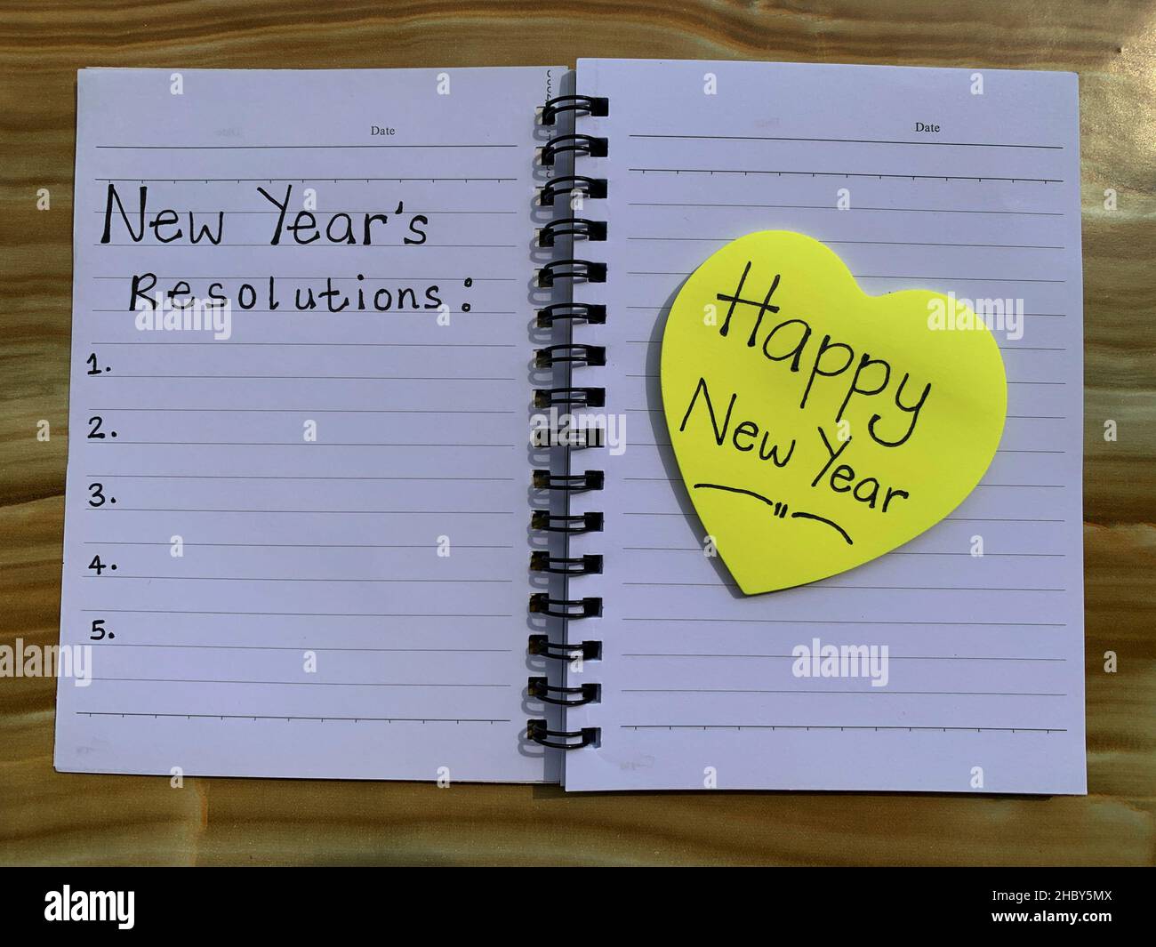 Beautiful wishes on sticky notes with new year resolutions note written ...