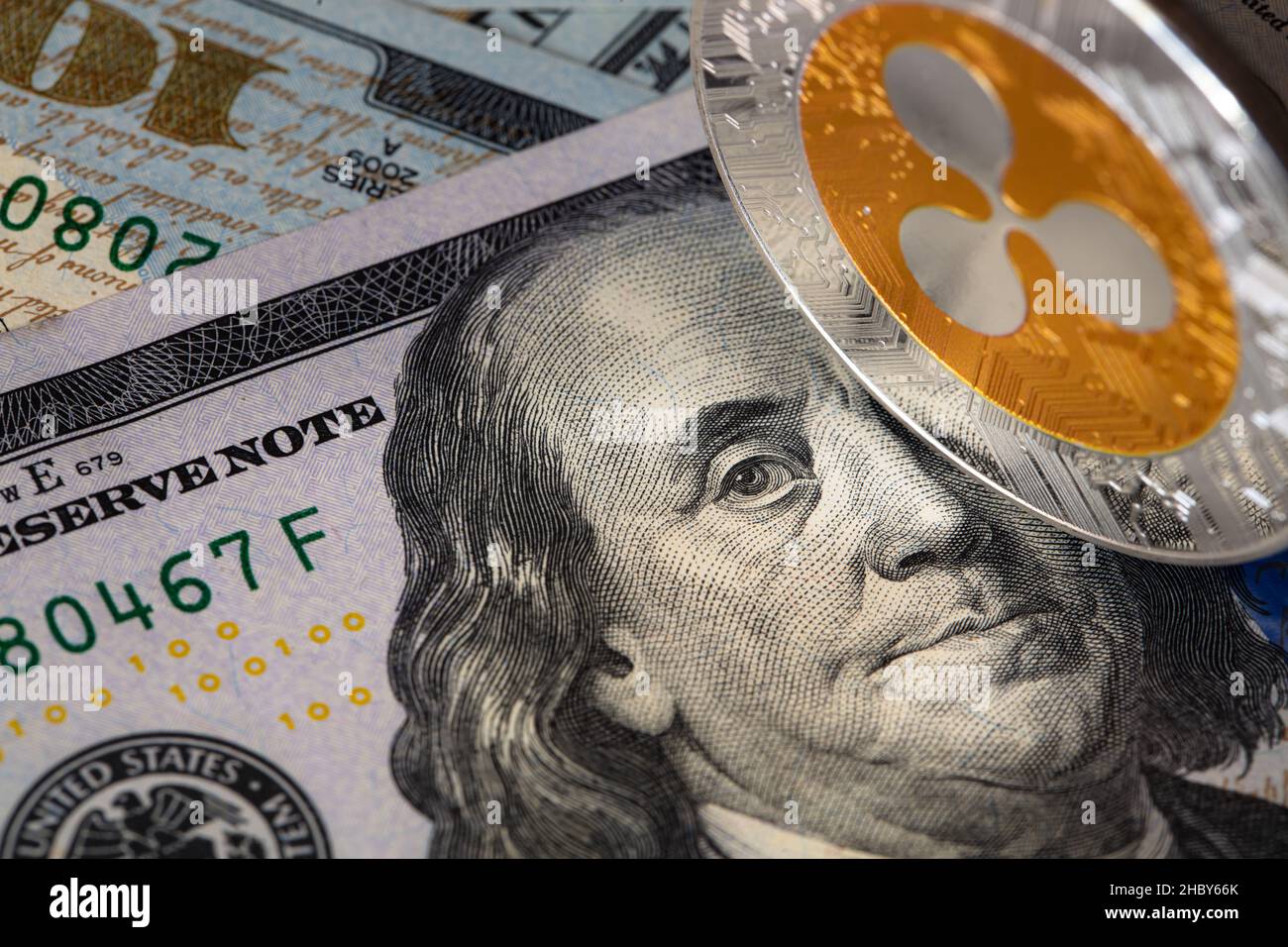 Ripple coin, XRP token, cryptocurrency on US 100 dollar background for ...