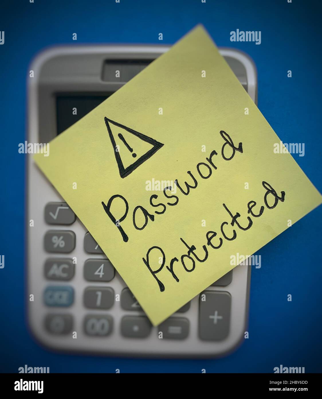Password protected text written on sticky note on top of a blurred ...