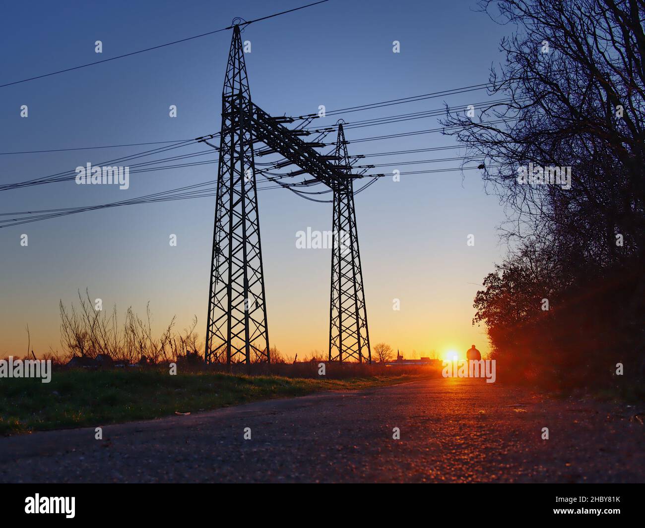 An electrical power tower and lines on a sunset background Stock Photo ...