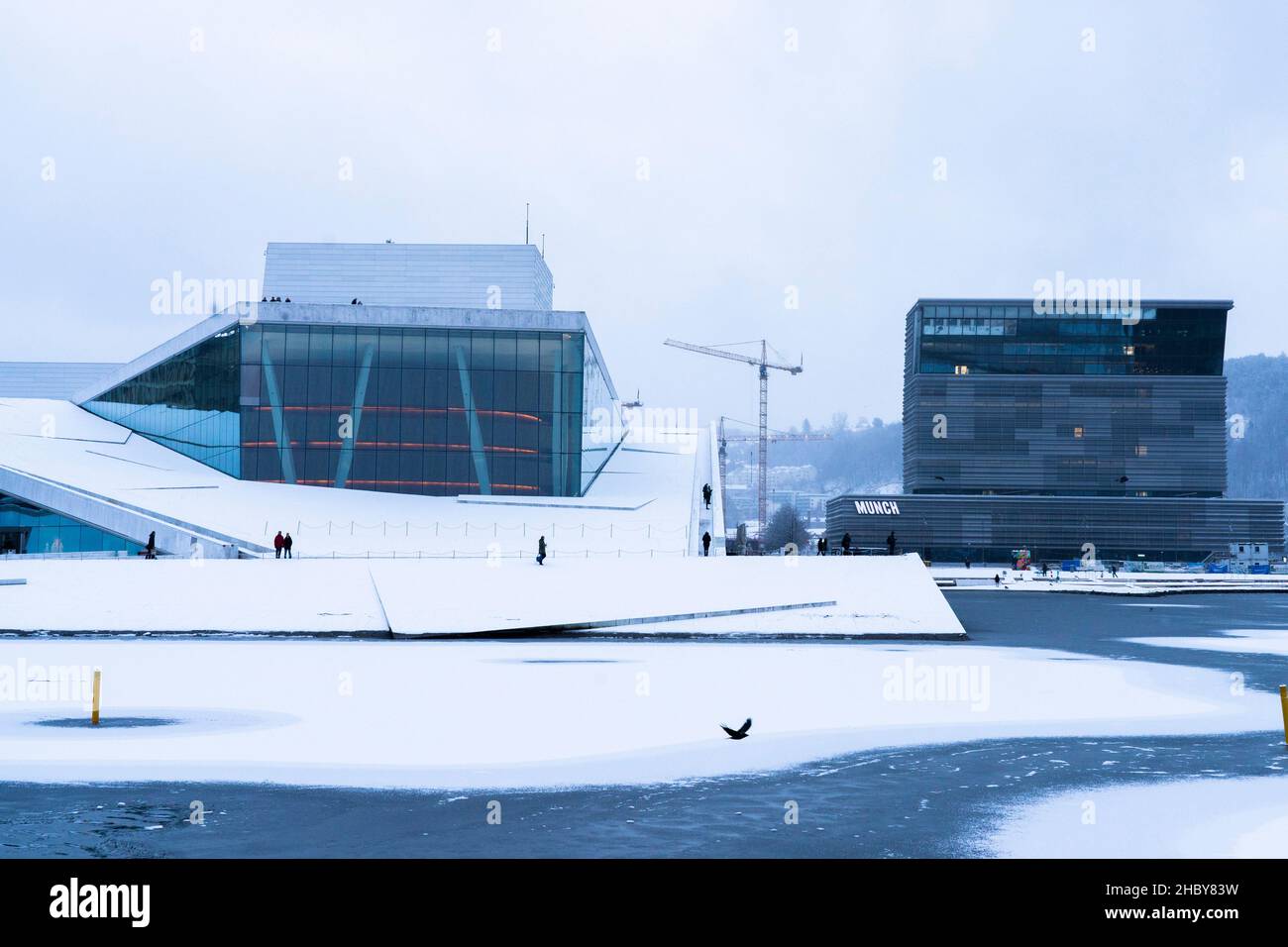 Oslo 20211222.The sea has frozen to ice in front of the Opera House and ...
