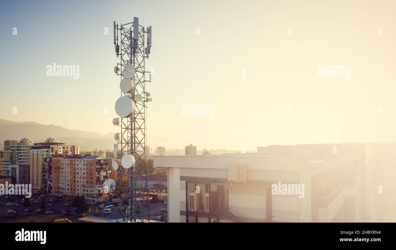 Close-up view from a drone of a telecommunications tower with cellular ...