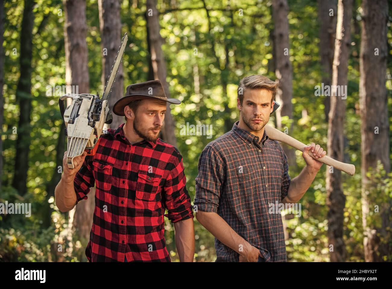Surviving in wild nature. human and nature. men hiking in wood ...