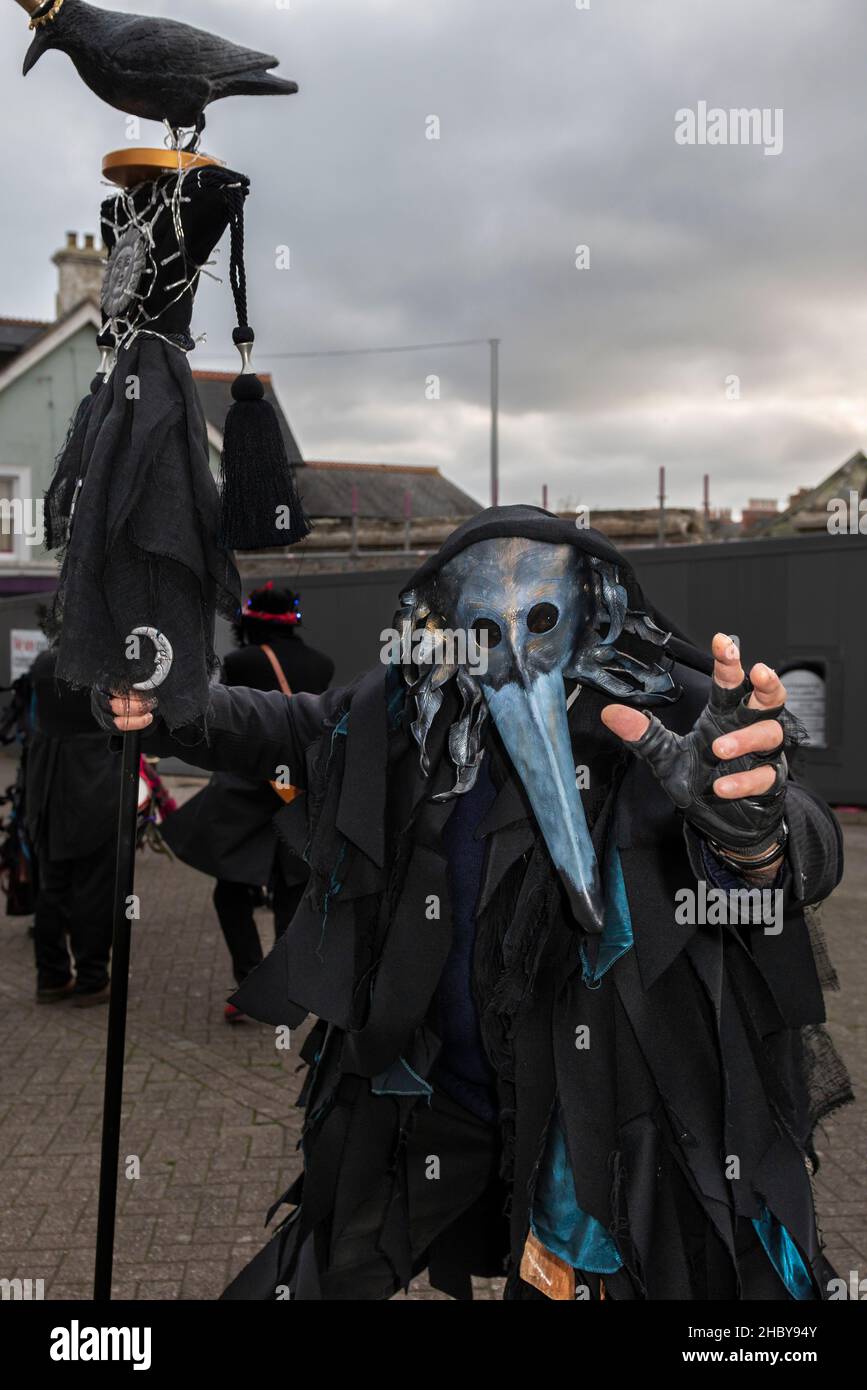 A masked participant in the Montol Festival parade; in Penzance in ...