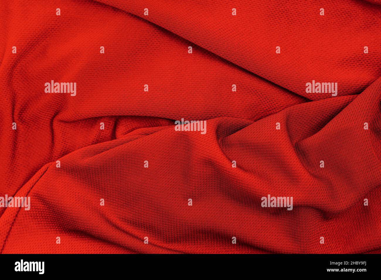 Saturated red color twisted fabric for texture background Stock Photo ...