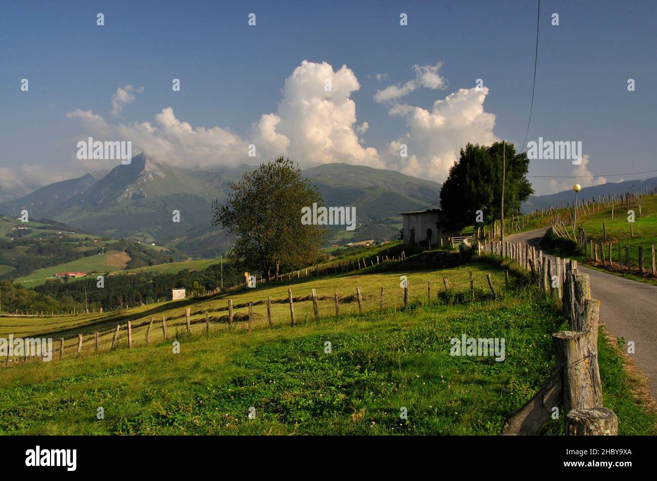 Road in Lazkaomendi with Mount Txindoki in the background Stock Photo ...