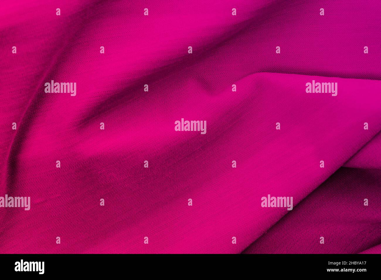 Pink color folded cotton fabric for cloth background Stock Photo - Alamy