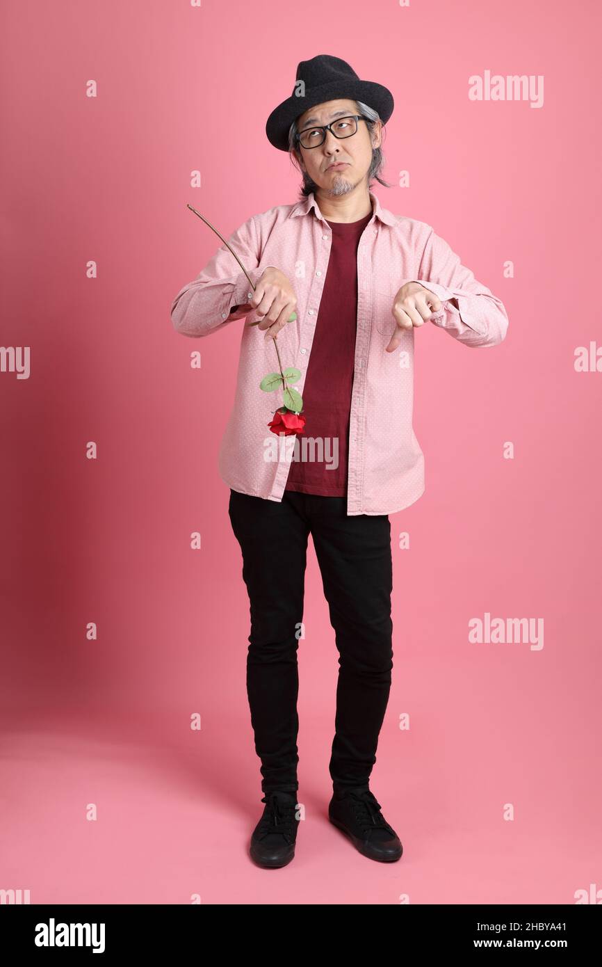 Sad man holding pink hi-res stock photography and images - Alamy
