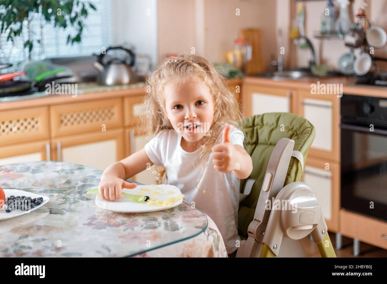 Happy little girl child show gesture of approval, Thumbs up by finger ...