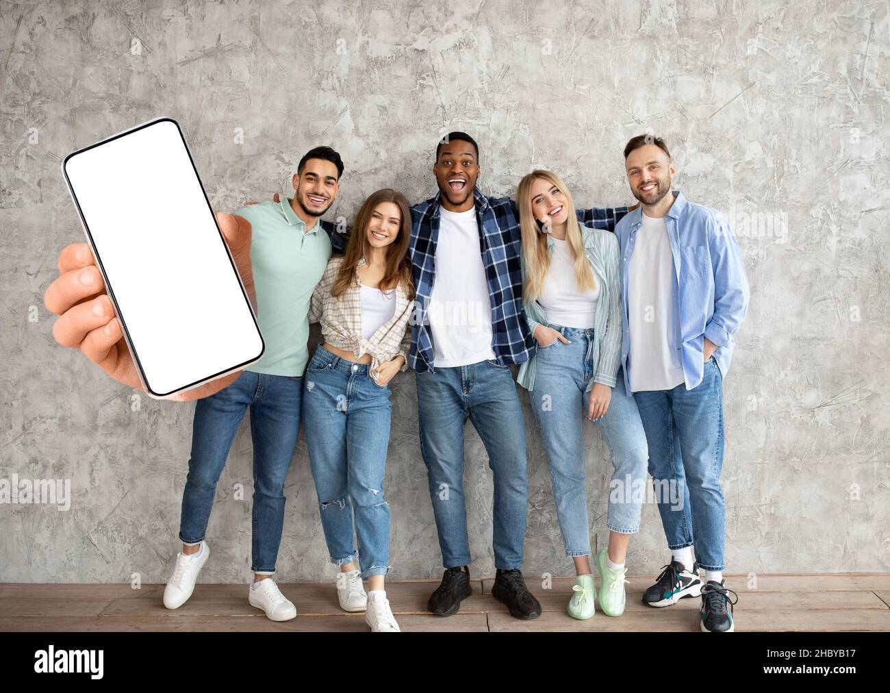 Diverse people showing white empty smartphone screen in hand Stock ...