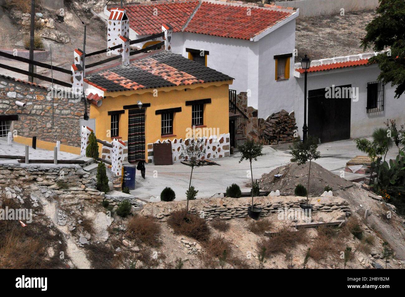 Yellow cave house in village, Orce, Andalucia, Spain Stock Photo - Alamy