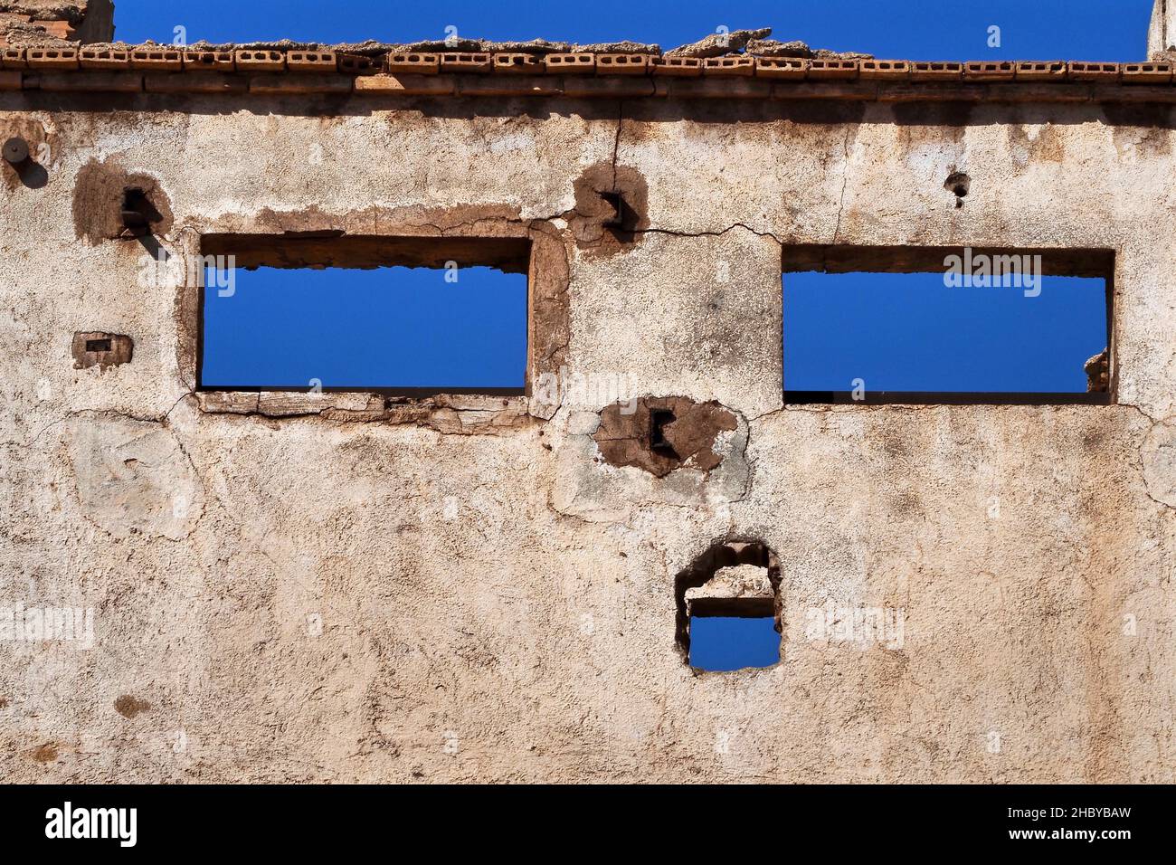 Holes in the facade of a house Stock Photo - Alamy